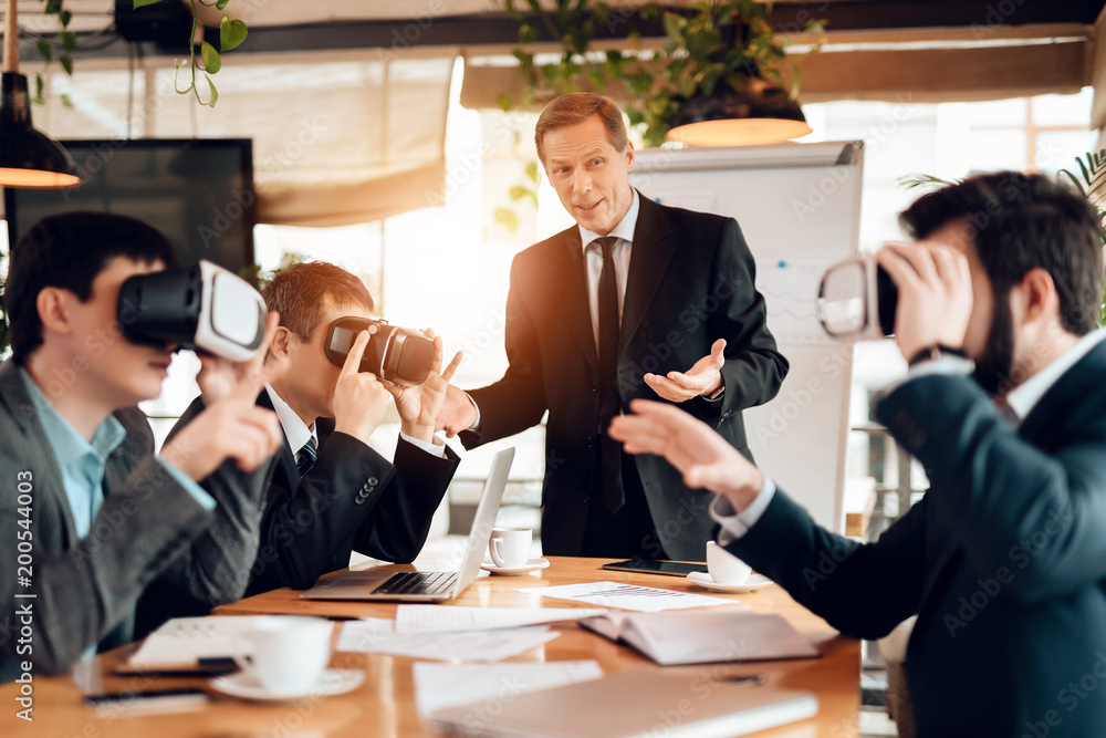 Meeting with chinese businessmen in office. Men are using virtual ...