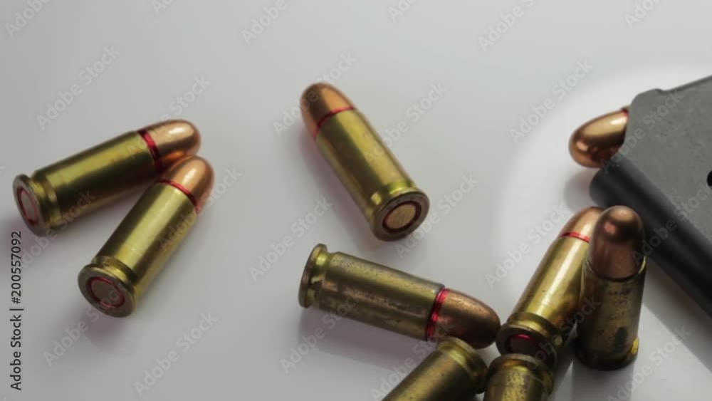 Over head shot of bullets and a clip from a police gun. Criminal ...