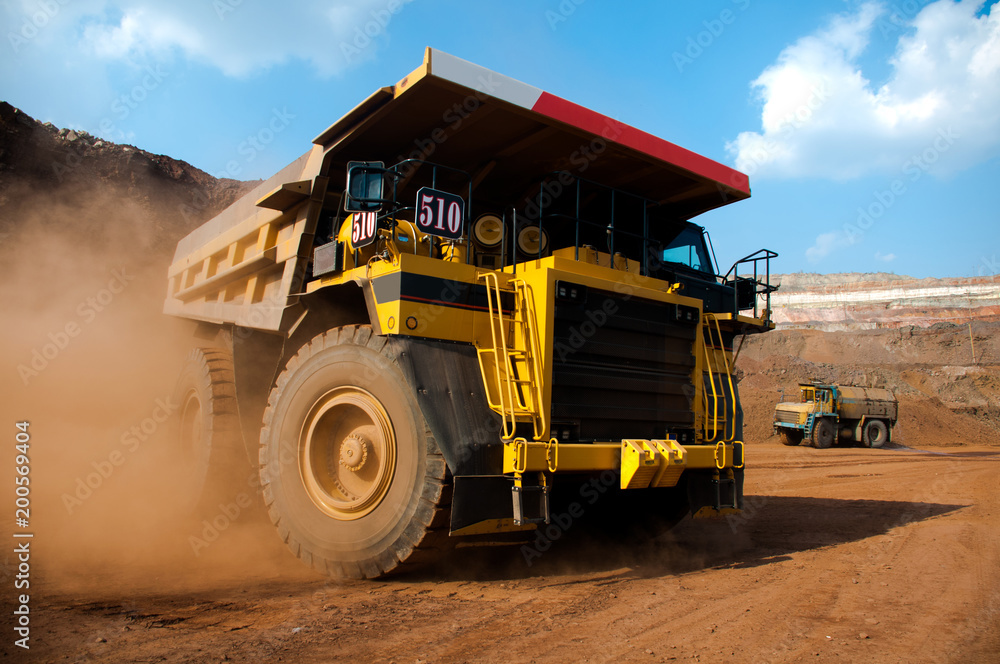 The work of a heavy quarry dump truck in the iron ore quarry. Stock ...