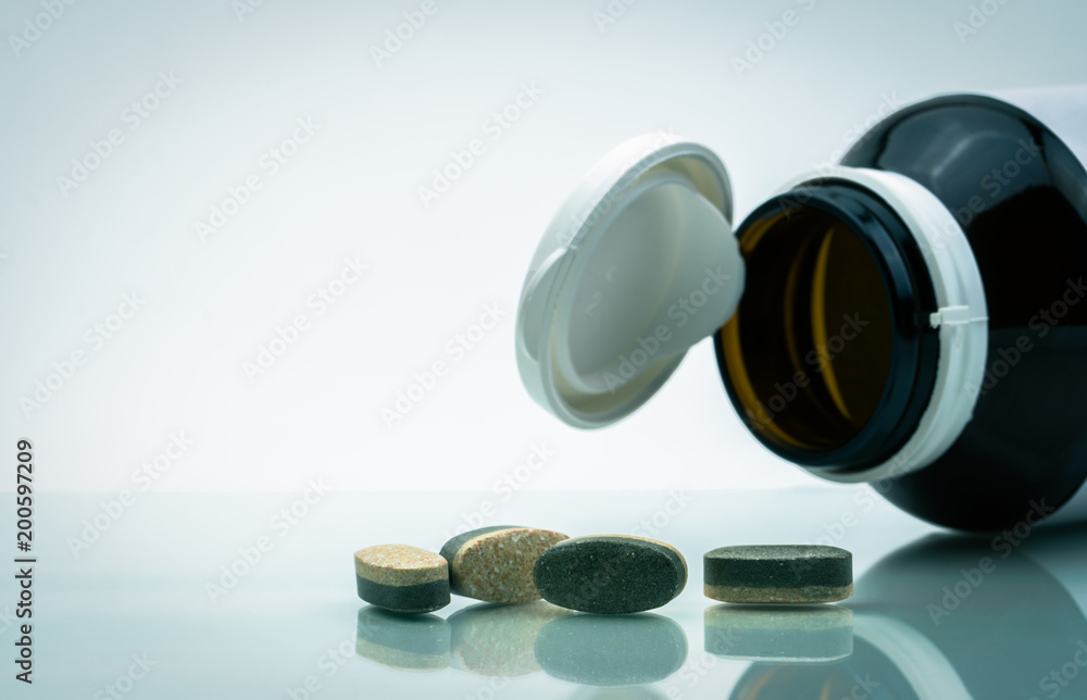 Essential Vitamins and minerals supplements dual layer tablet pills and ...