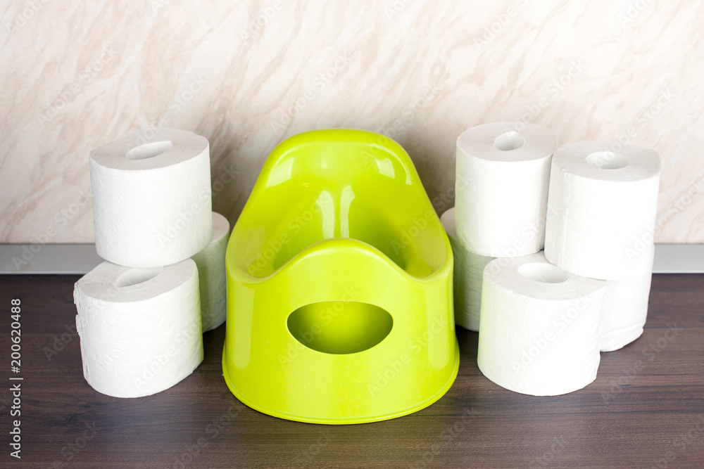 children's toilet pot green and toilet paper, the concept of moving the ...