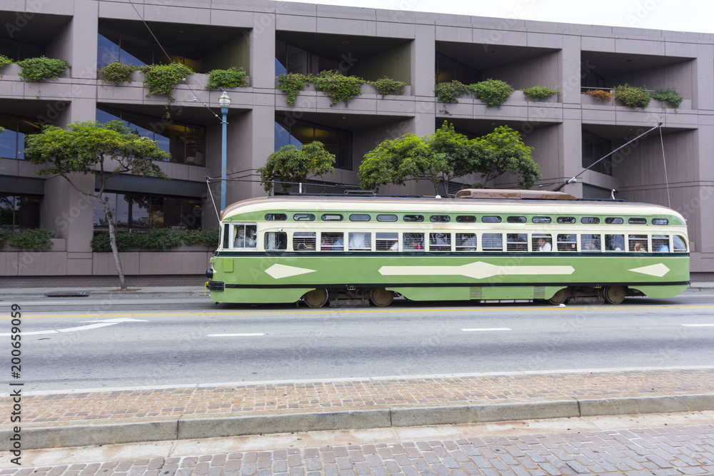 The old colored trams, cable trolley cars, on the streets of San ...