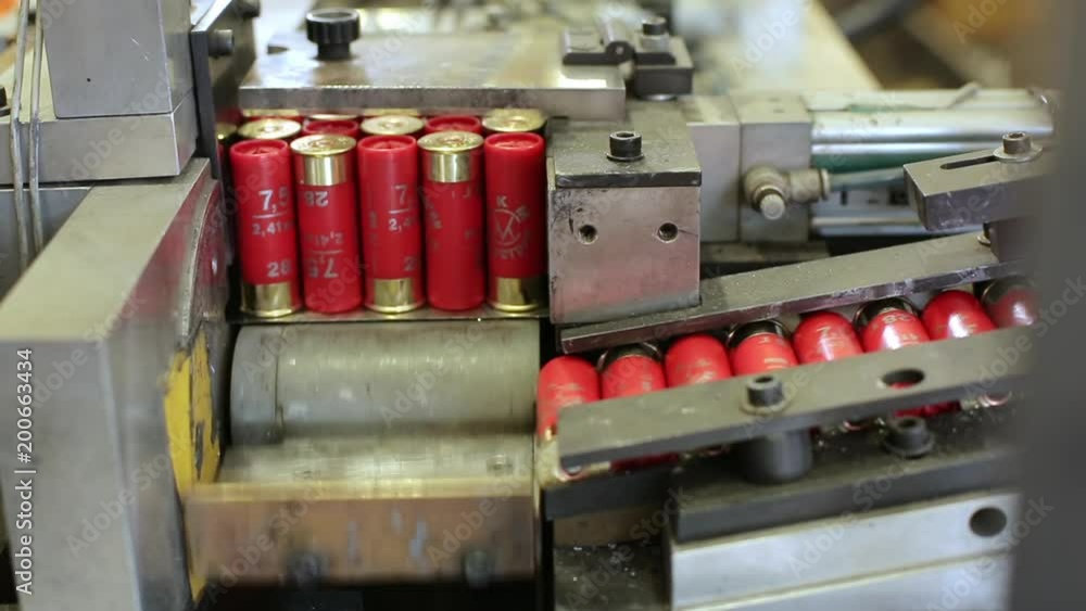 Process of production of bullets. Industrial concept. Factory equipment ...