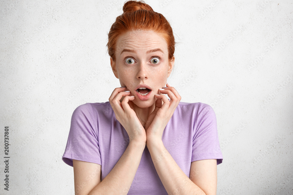 People, reaction and emotions concept. Surprised freckled ginger female ...