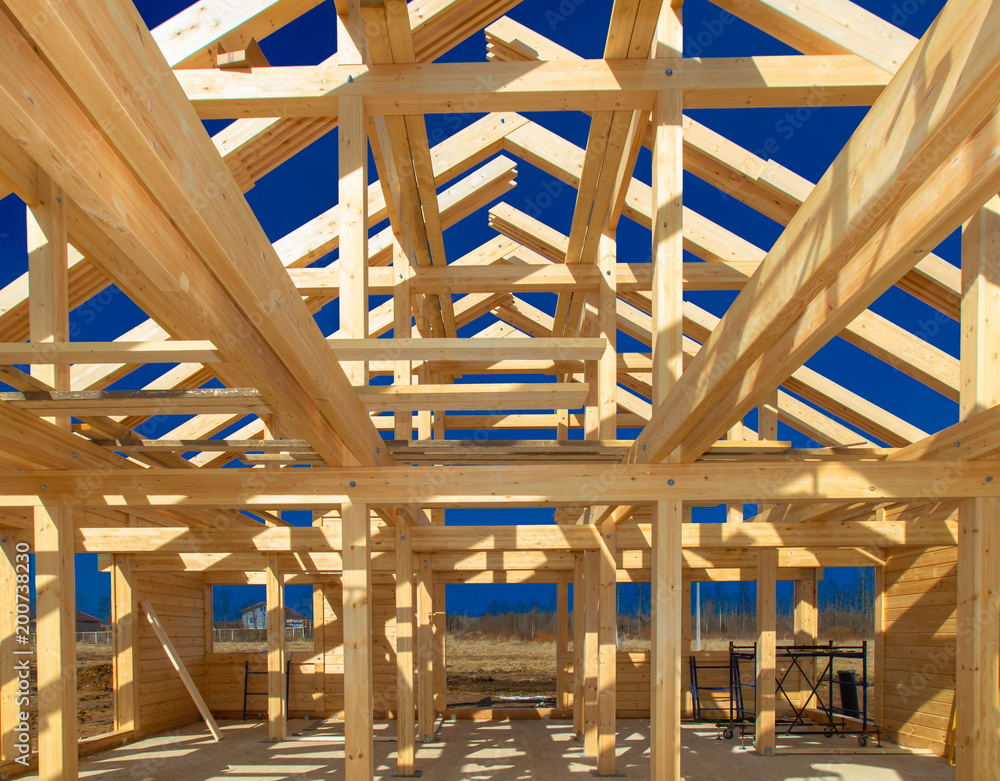 The frame of the house. Construction works. Cottage made of wood ...