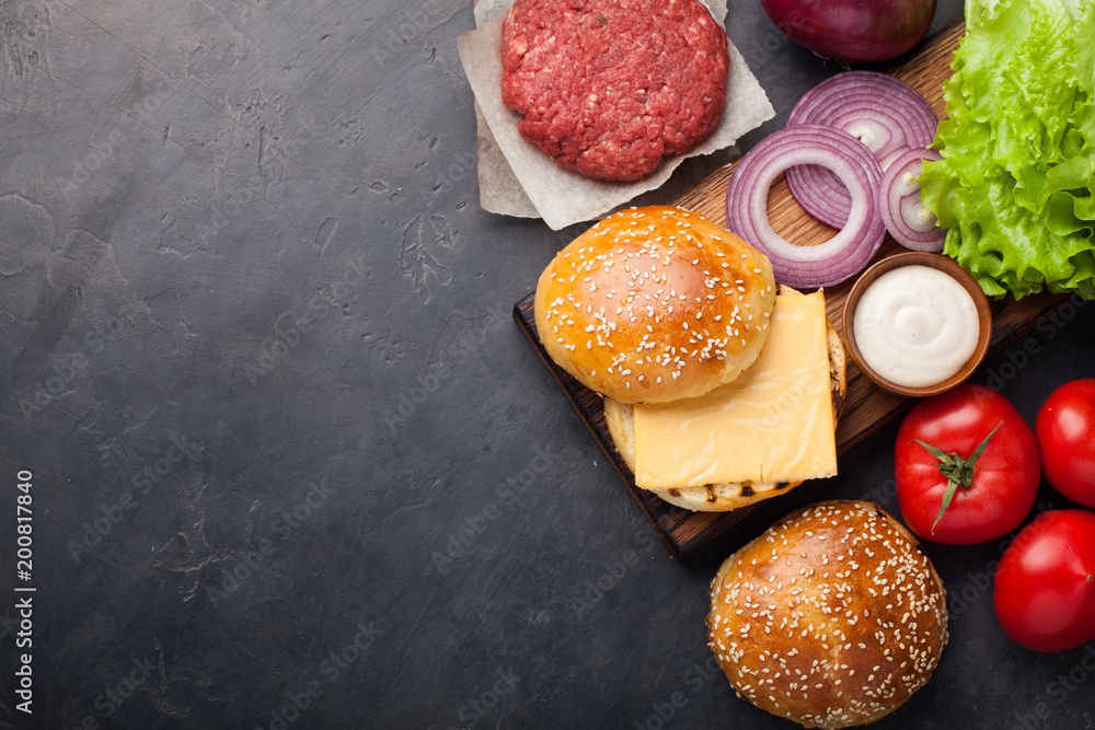 Hamburger Building Kit. Fresh ingredients for Burger on dark stone ...