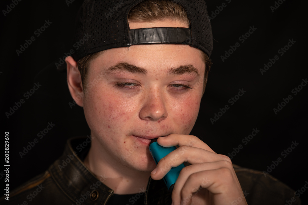 teenager is high from vaping cannabis oil Stock Photo | Adobe Stock
