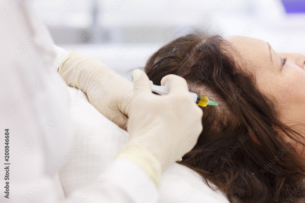 rear view close up of the uncertain doctor which is carrying out ...