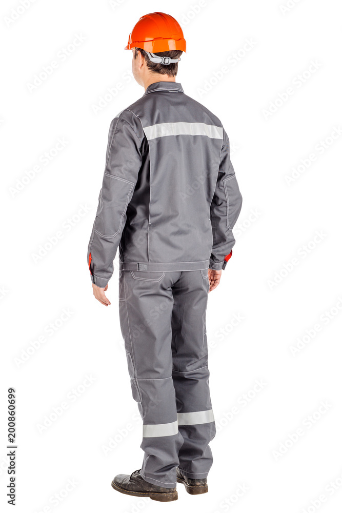 Full length portrait of a male builder over white wall background ...