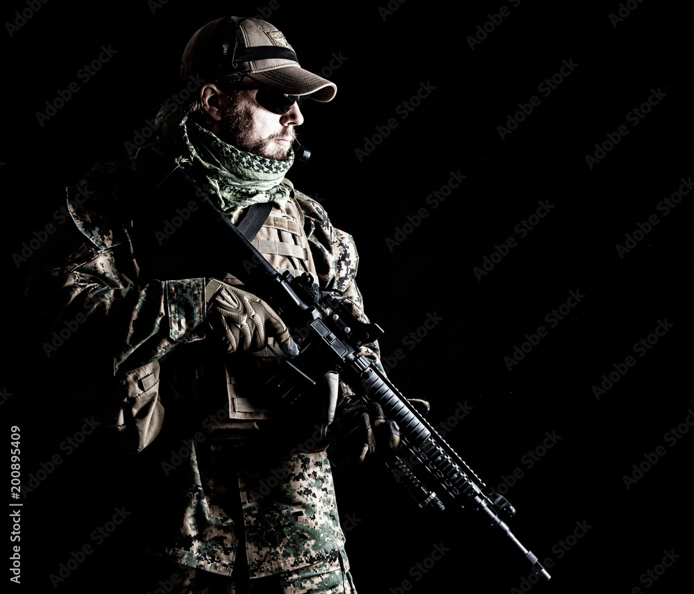 Studio shot of United States Marine with rifle weapons in uniforms ...