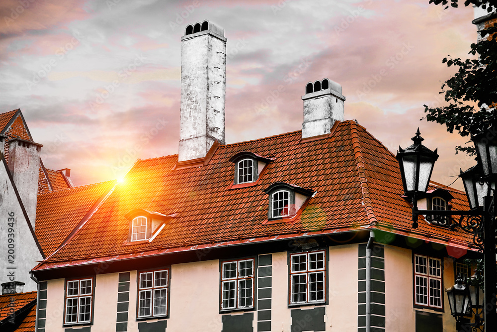 Roofs of old houses in Skarnu iela street in Riga, Latvia against blue ...