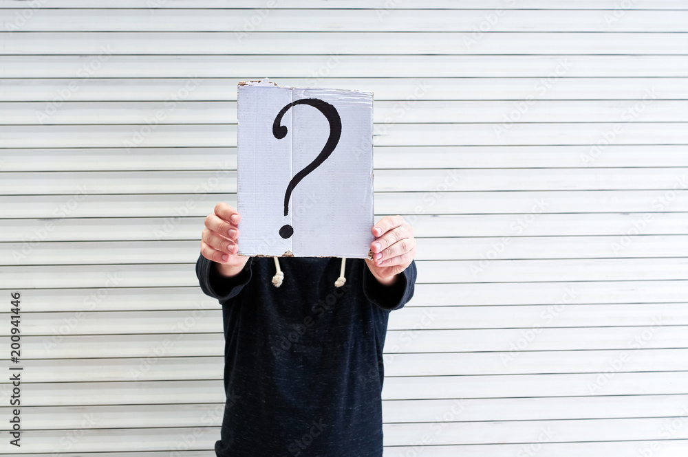 man standing with question mark on board Stock Photo | Adobe Stock