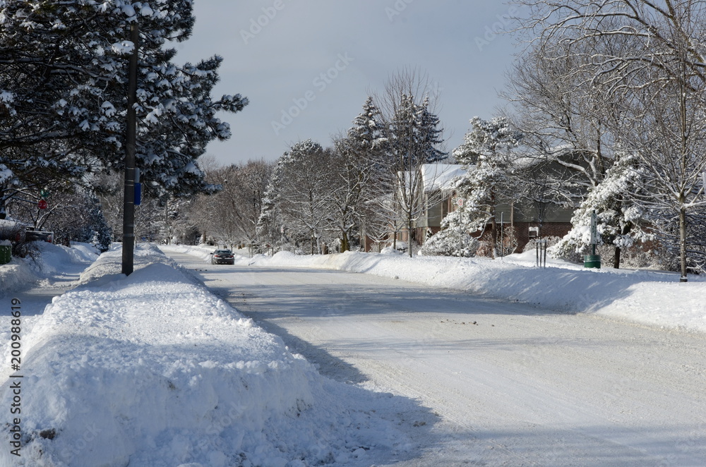 Heavy winter snow fall in a Canadian city street in residential area ...