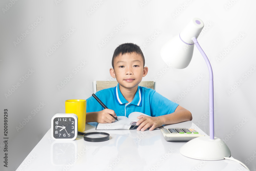 Soft cute child working on work desk. Asian child boy is active and ...