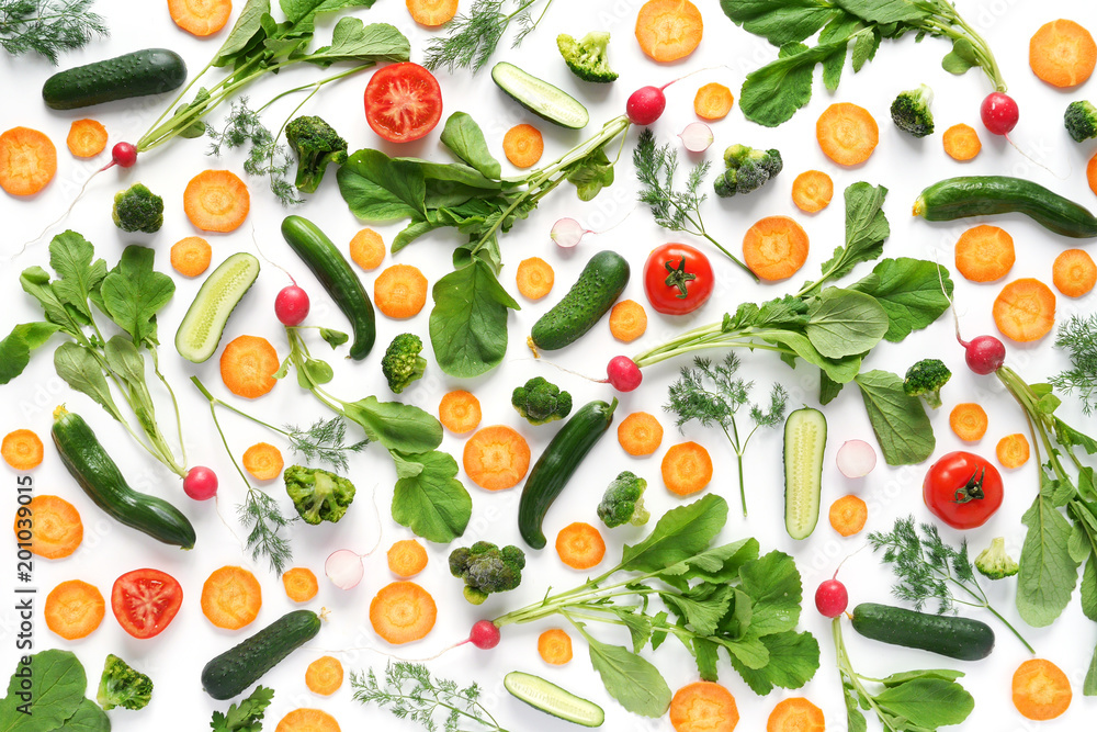 Fresh vegetables and greens on a white background. Pattern of ...