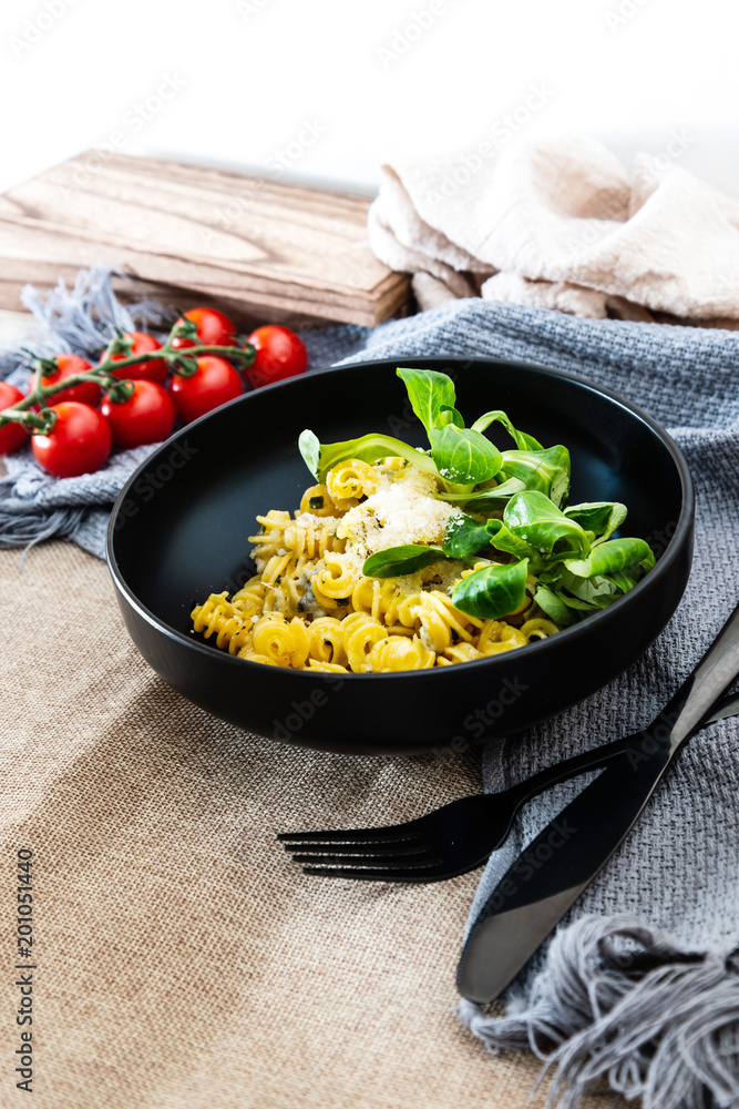 Radiatori pasta in a creamy tomato parmesan cheese sauce Stock Photo ...