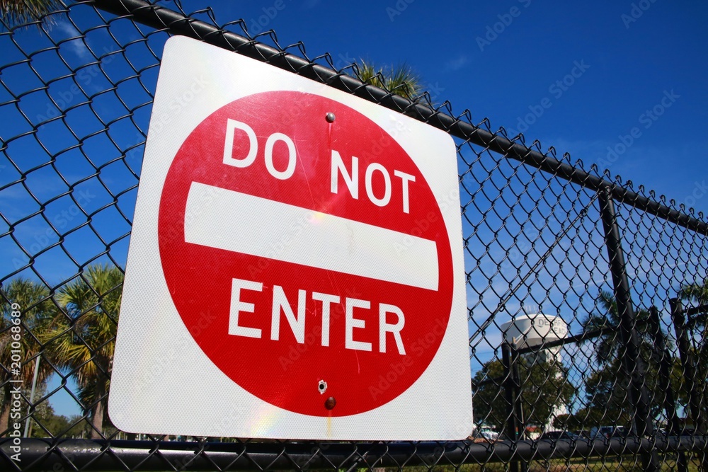 Red and White Do Not Enter Sign on Chain Link Fence with Deerfield ...