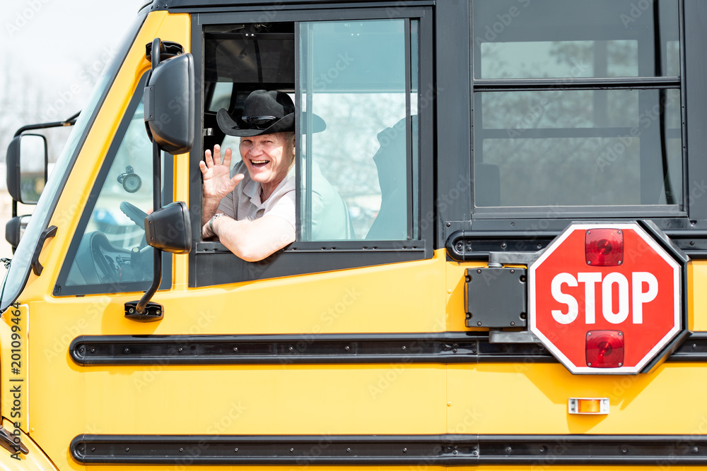 School bus driver waving out window Stock Photo | Adobe Stock