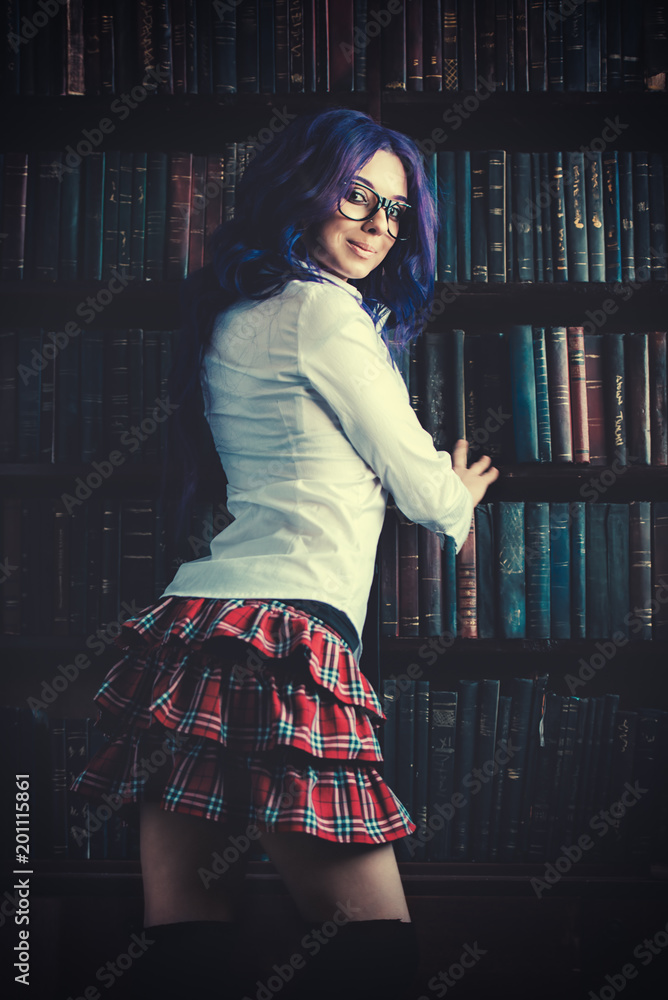 schoolgirl in library Stock Photo | Adobe Stock
