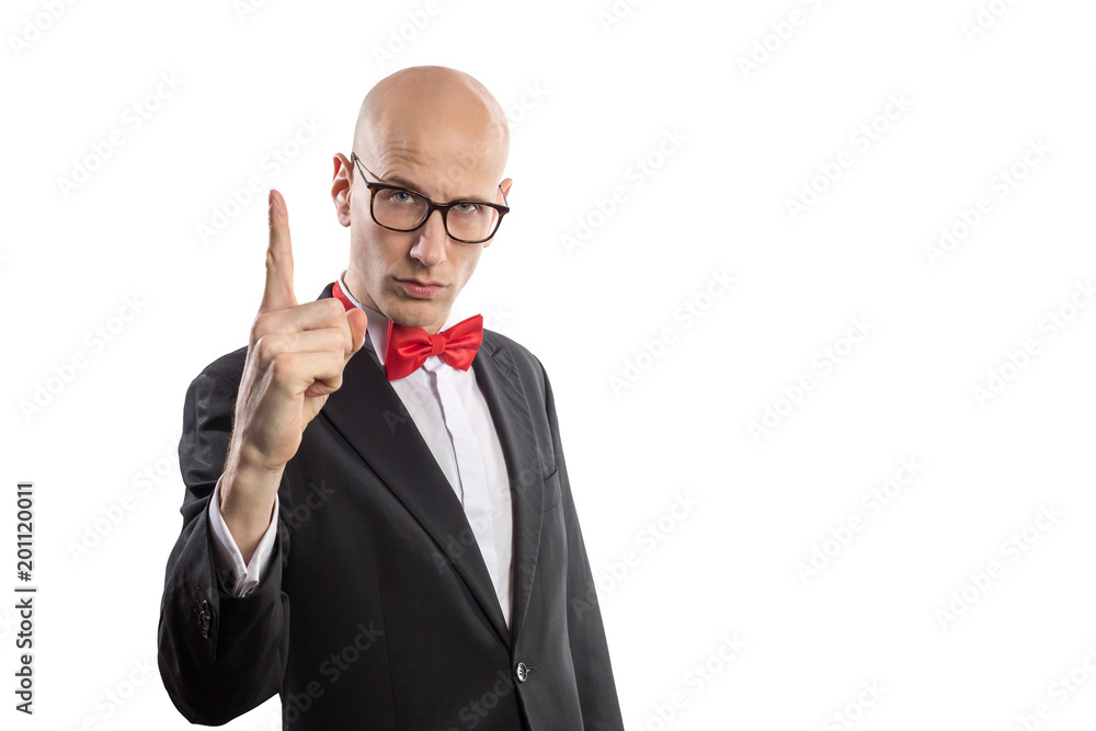slim bald elegant nerd with glasses and bow tie looking at the camera ...