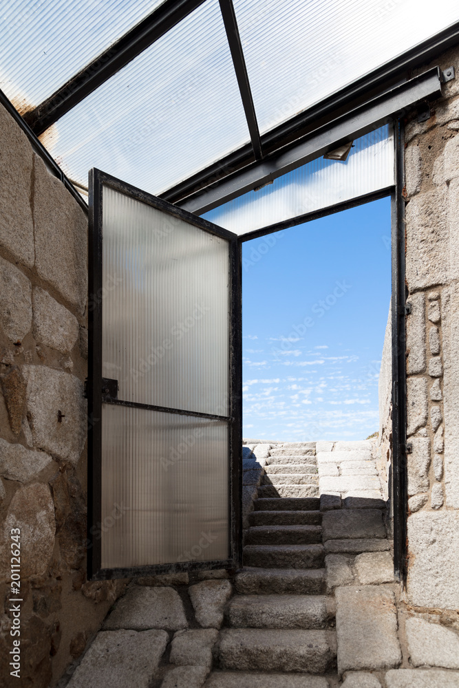 Open door with staircase in old stone building leading to rooftop Stock ...