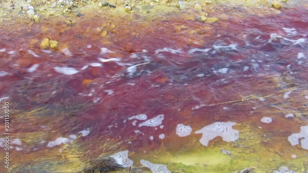 Vidéo Stock Copper and gold mining residuals flow. Polluted red water ...