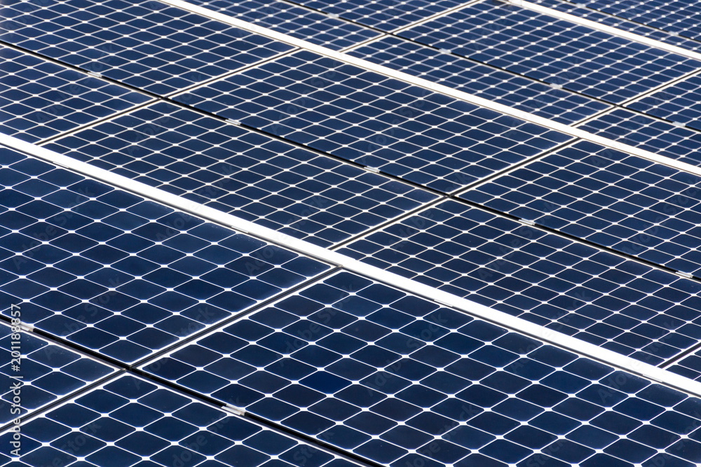 Blue rotating solar panels tilted axis tracker, future energy concept ...