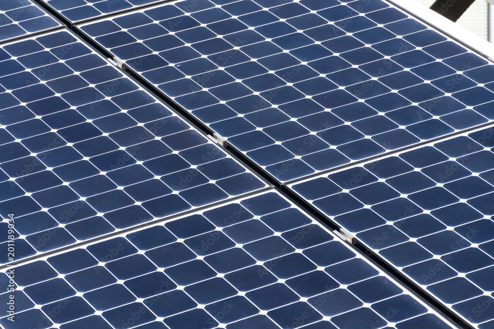 Blue rotating solar panels tilted axis tracker, future energy concept ...