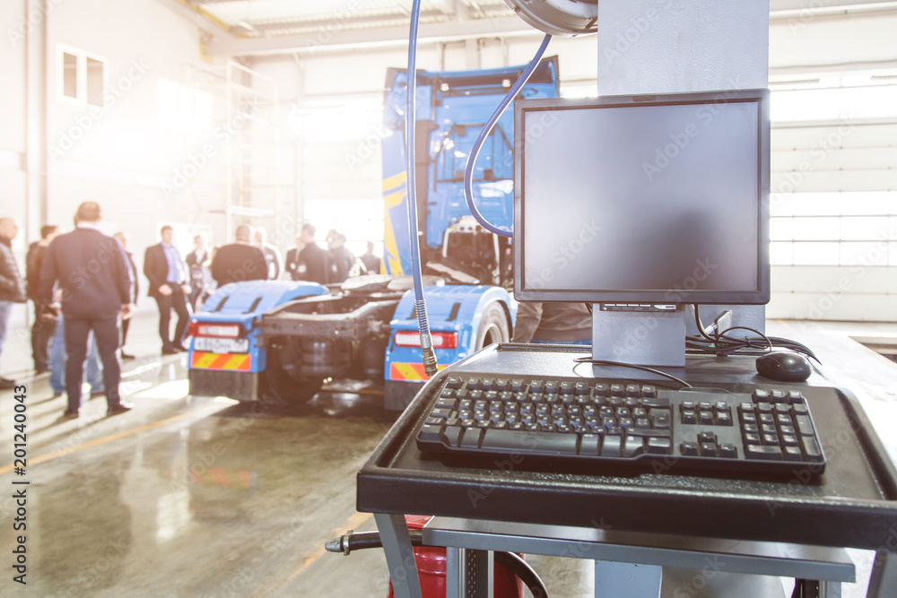 Monitor and keyboard at a stationary service point of trucks in a large ...