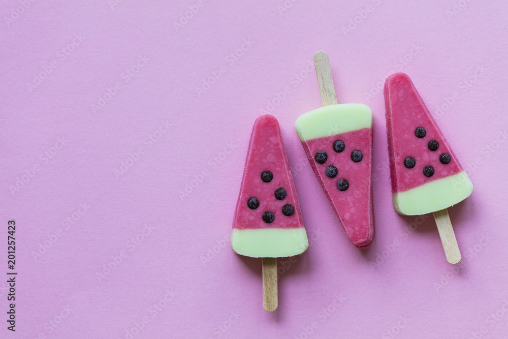 Watermelon shaped summer ice lolly on a pastel pink background Stock ...