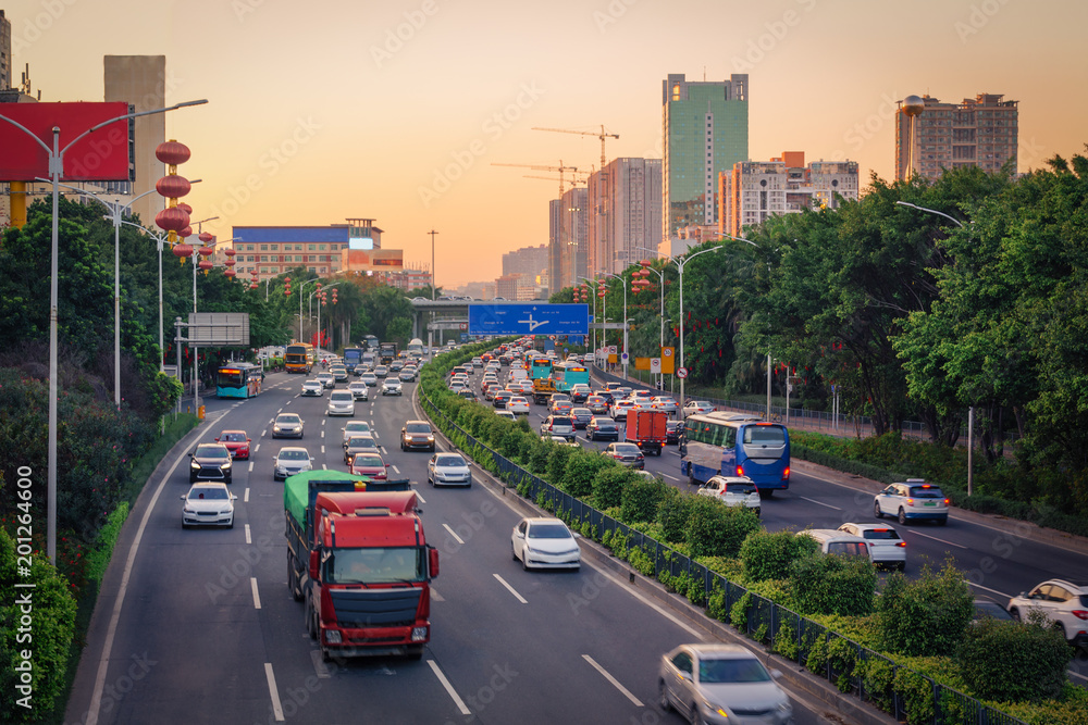 Evening rush hour in big city, traffic jam from many cars on divided ...