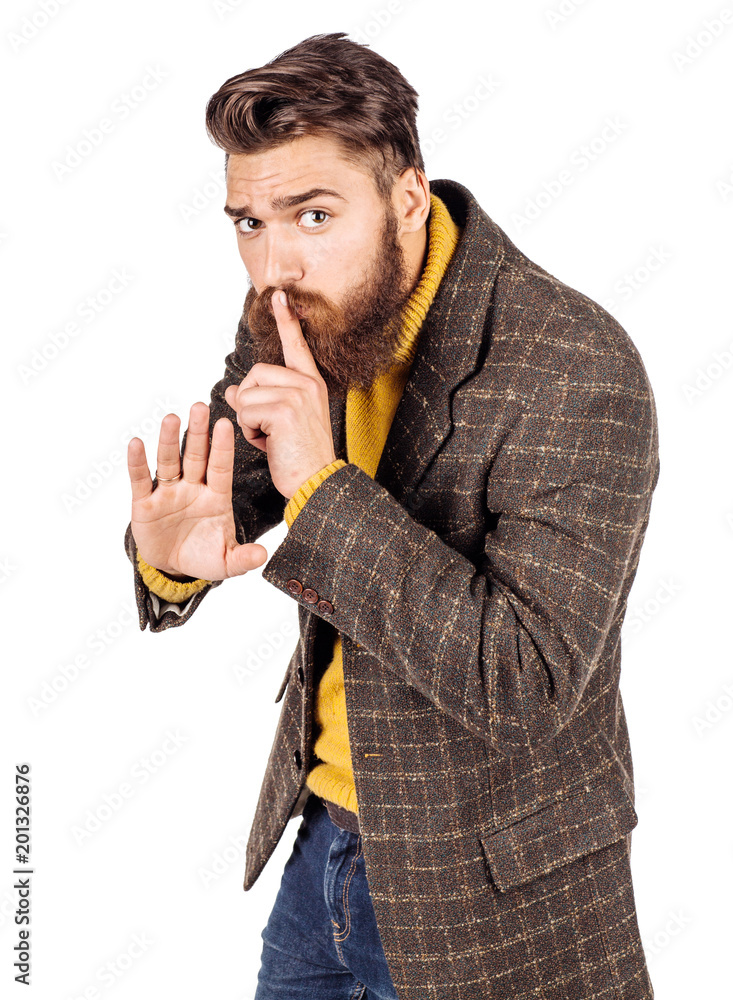 man making a shushing gesture raising his finger to his lips. emotions ...