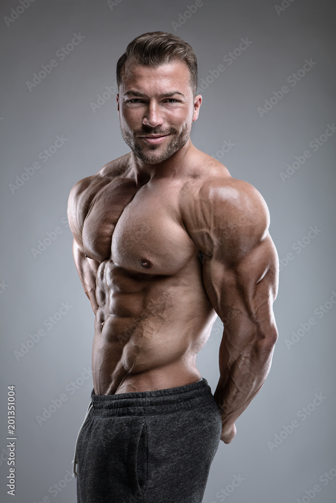 Strong Athletic Man shows body and abdominal muscles Stock Photo ...