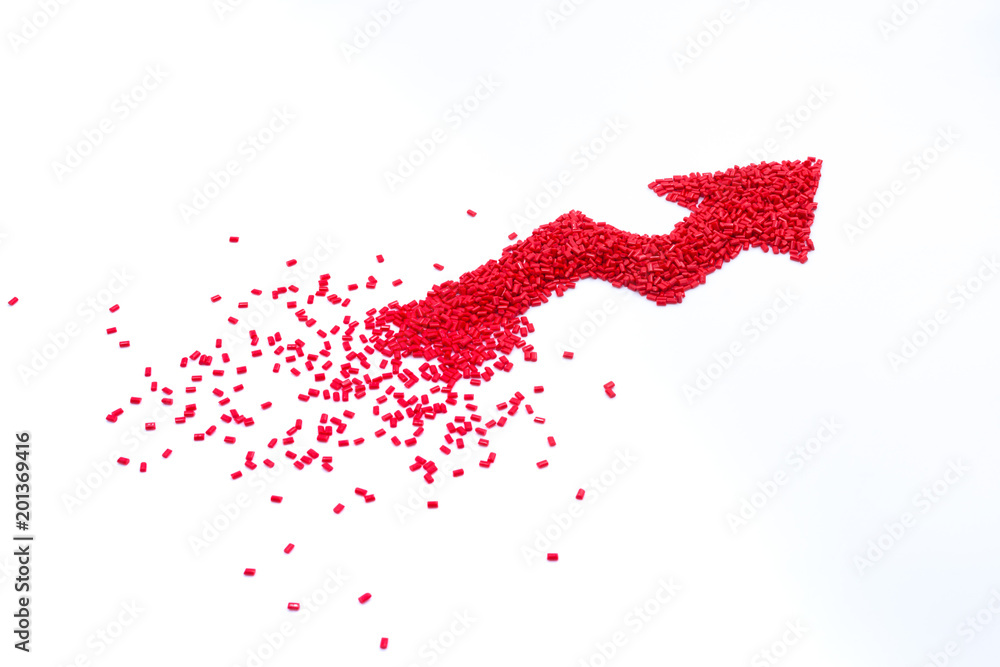 Red arrow design of plastic polymer granules isolated on white ...