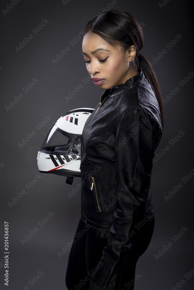 Black female motorcycle rider or race car driver wearing a racing ...