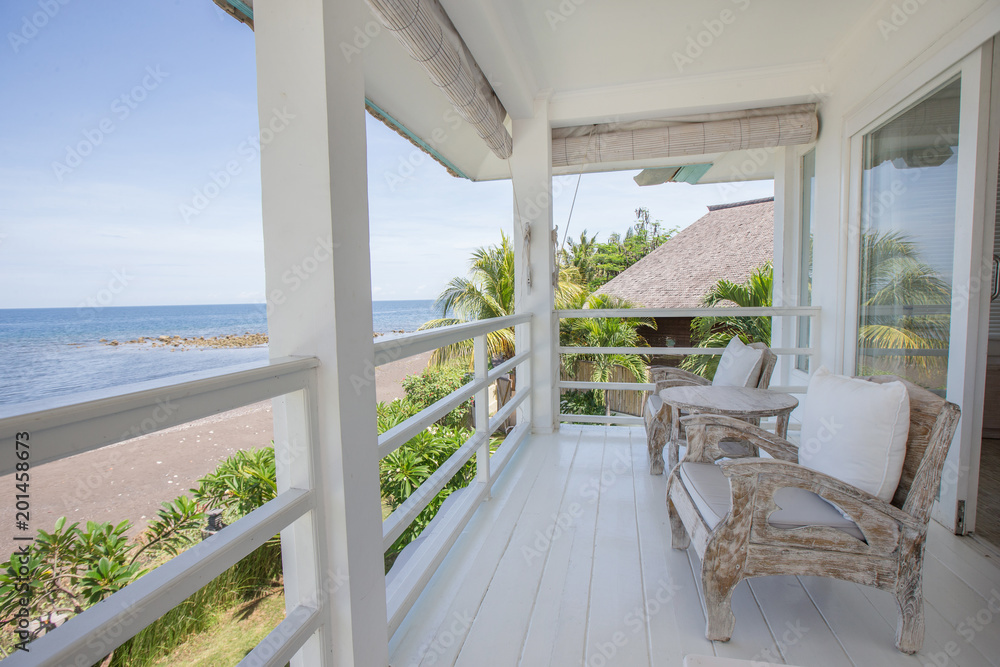 Sea view with blue sky from high floor of luxury hotel room terrace ...