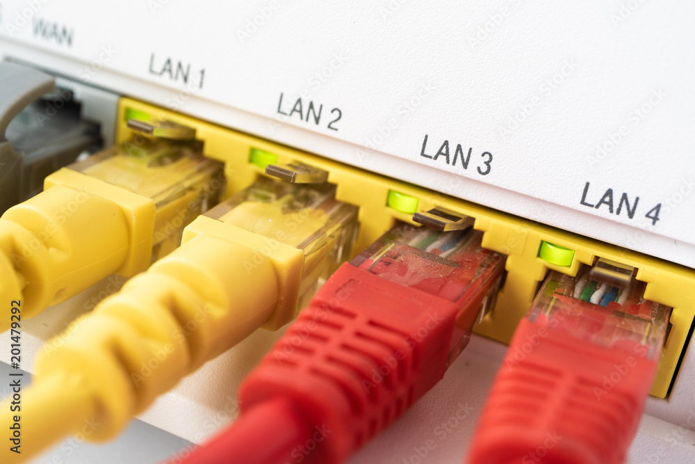 Red ethernet cables are connected to blue internet switch. Symbol of ...