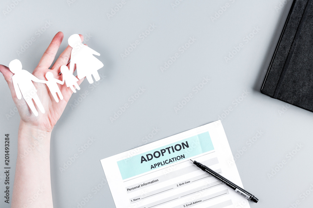adoption form and family figures on desk background top view moc Stock ...