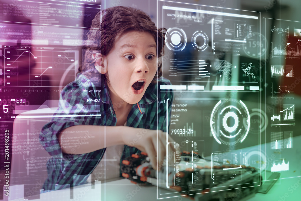 Incredible robot. Emotional little talented boy feeling impressed and ...