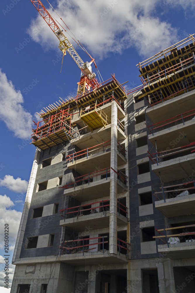 New residential building with hgh rise tower crane construction site ...