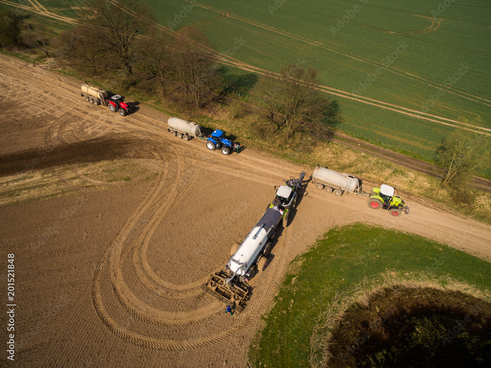 Poster Aerial view of modern Tractor with liquid manure on the ...