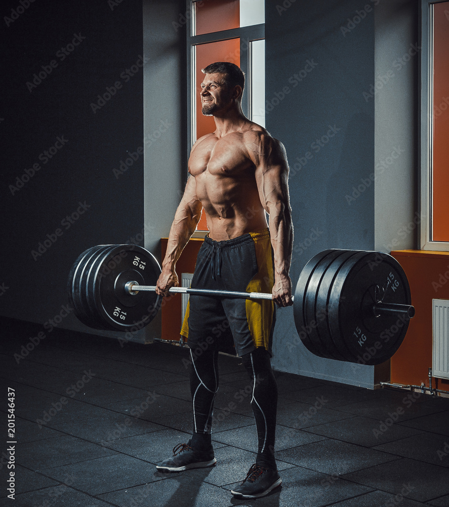 european caucasian athletic man doing deadlift with heavy barbell. man ...