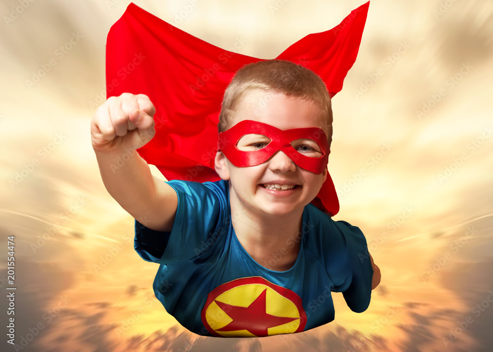 Boy in superhero costume guard the planet and show super abilities ...