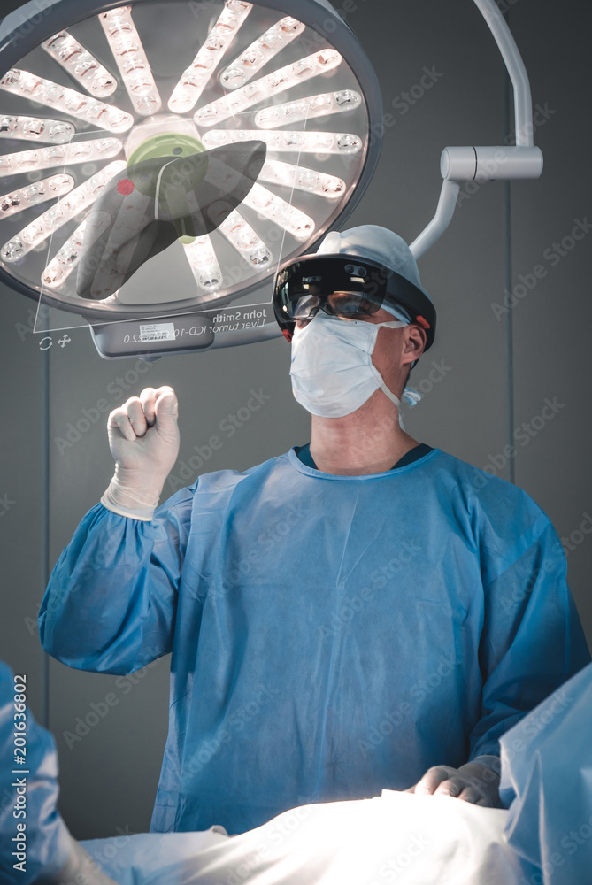 Surgeon using augmented reality holographic hololens glasses, preparing ...