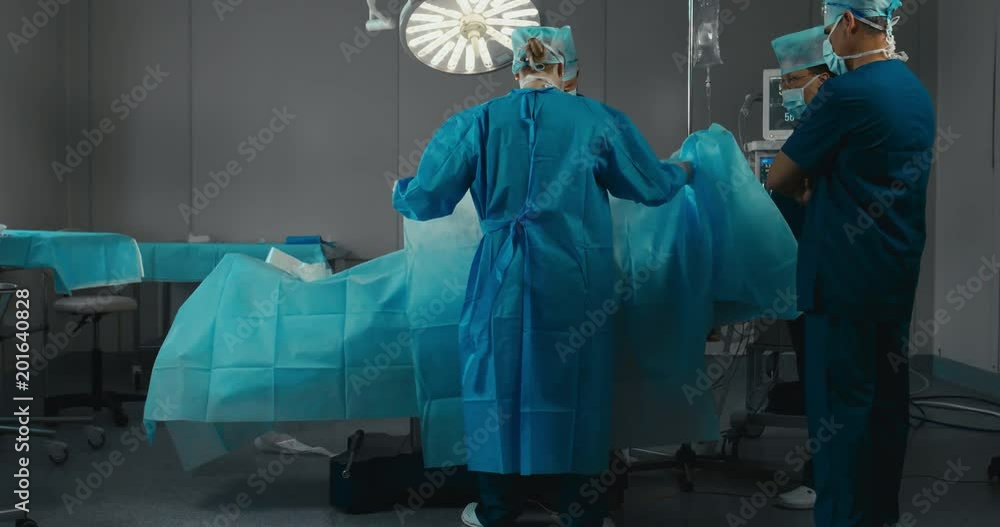 WIDE Medical team preparing for a surgical operation in real modern ...
