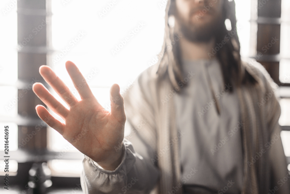 Jesus Christ reaching out his hand, peace symbol Stock Photo | Adobe Stock