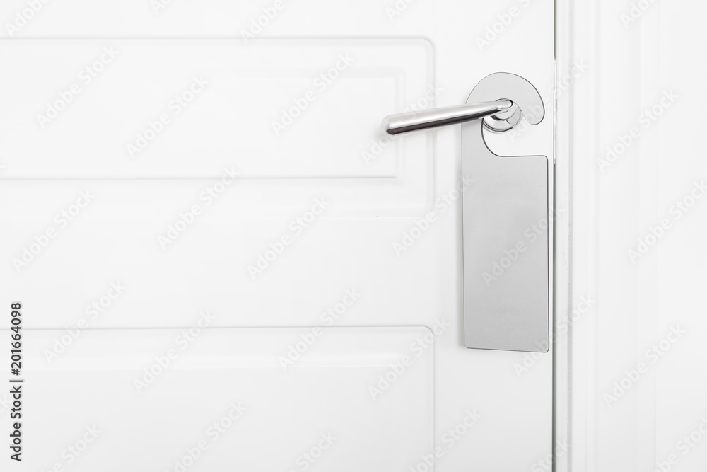 Door knob with empty label on a door handle for your text. Empty white ...