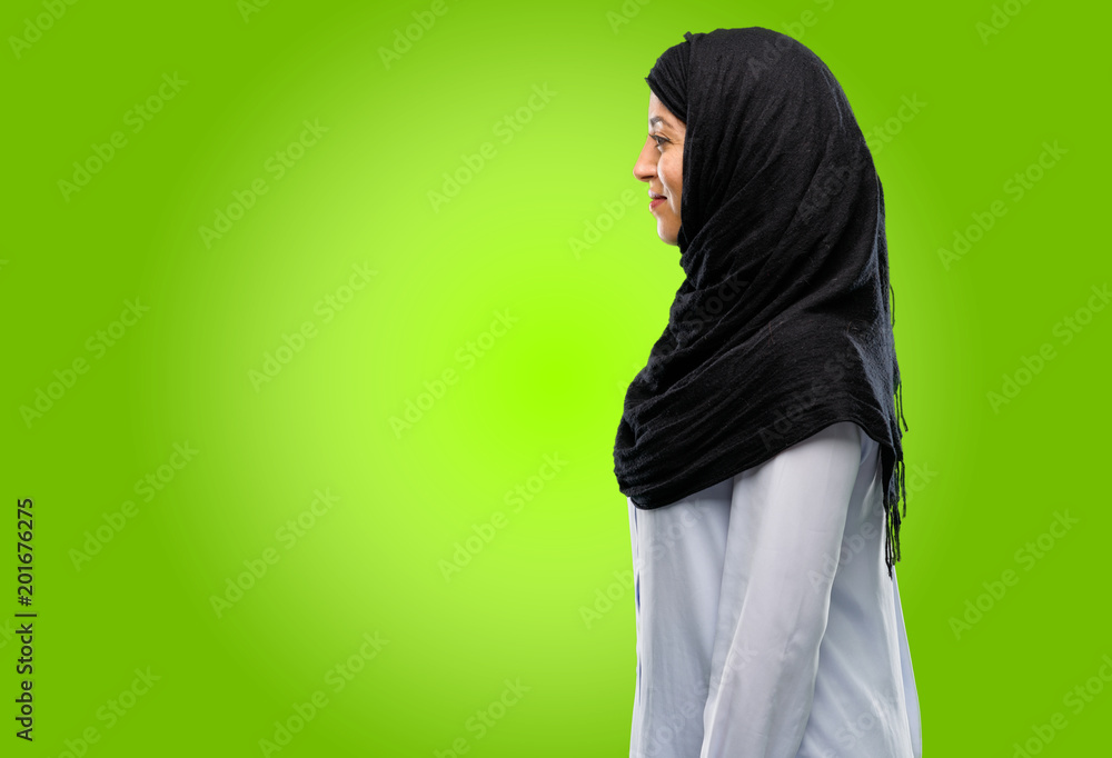 Young arab woman wearing hijab side view portrait Stock Photo | Adobe Stock
