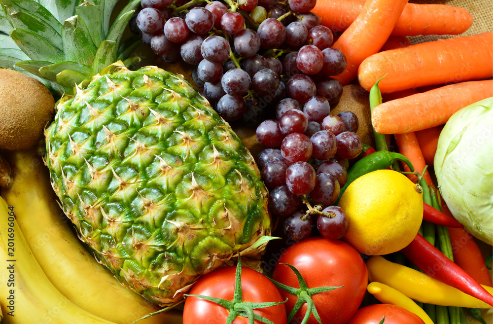 Colorful and various types of vegetables and fruits on sack background ...