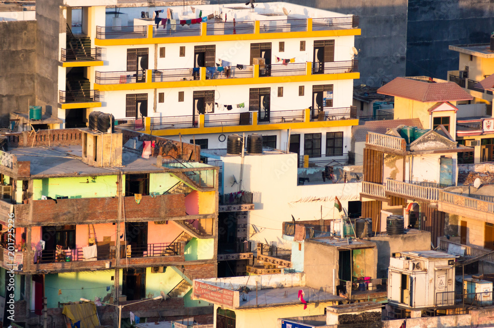 Old un repaired buildings in india with clothes hanging and furniture ...